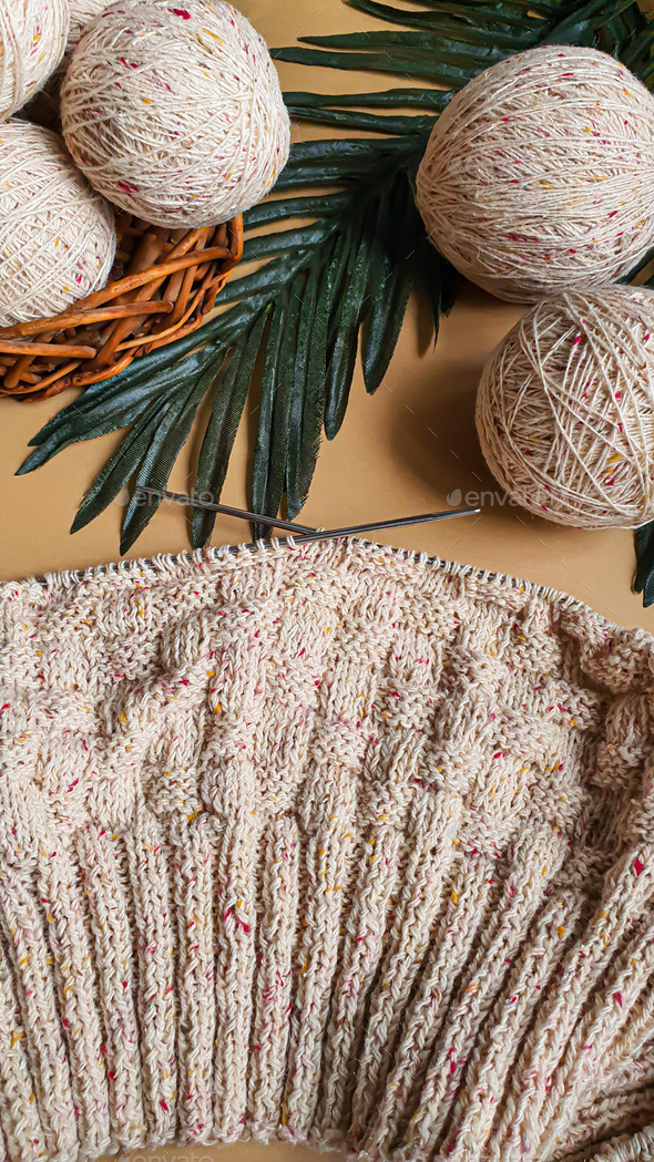 Knitted handmade items. Knitted fabric from colored thread. Bright ...