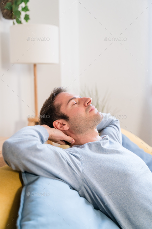 Relaxed man sleeping on sofa Stock Photo by TheAtticoStudioPhoto ...