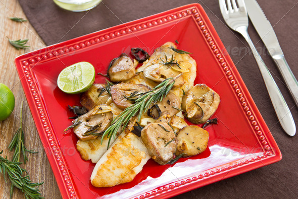 Grilled Dory fish with sautéed mushroom Stock Photo by vanillaechoes