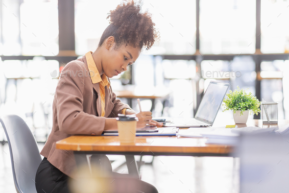 businesswoman analyzing statistics on laptop screen, working with ...