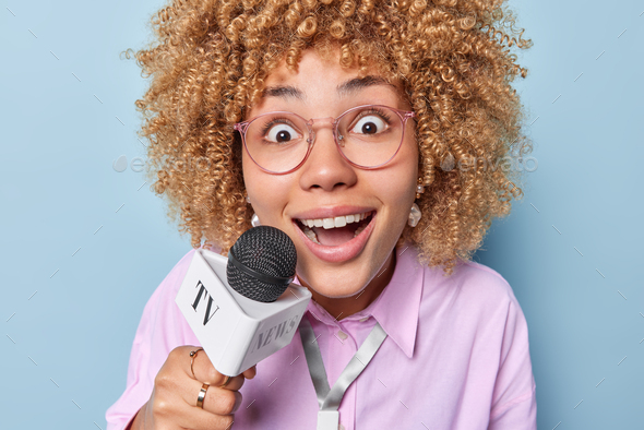 Photo of surprised female TV presenter looks with happy excited ...