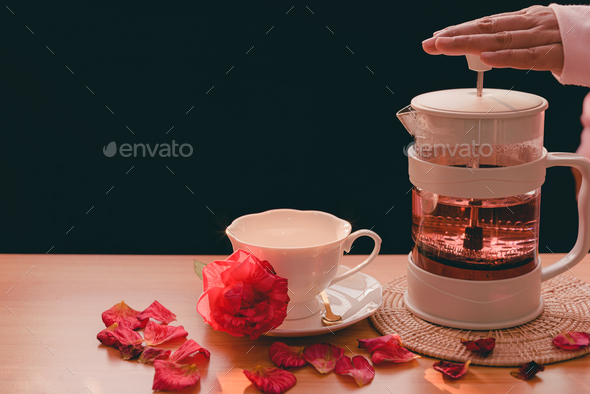 The process of brewing hot tea, rose tea, a relaxing and healthy herbal ...