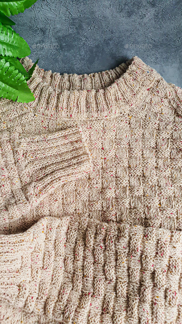 Knitted handmade items. Knitted fabric from colored thread. Bright ...