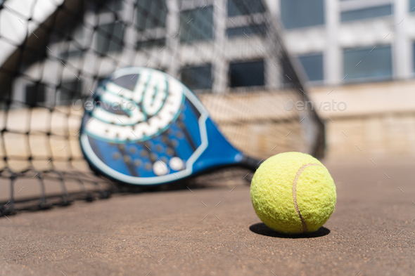 Padel racket and ball on court Stock Photo by diignat | PhotoDune
