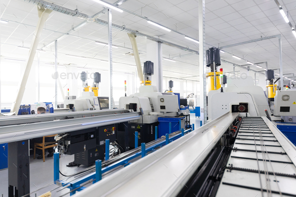 Conveying system with metal products on it in works Stock Photo by ...