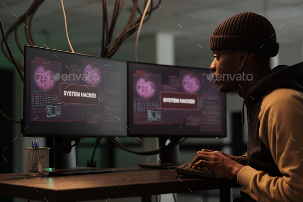 System hacked by professional hacker late at night Stock Photo by DC_Studio