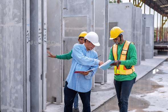 At building construction site supervisor check quality precast concrete ...