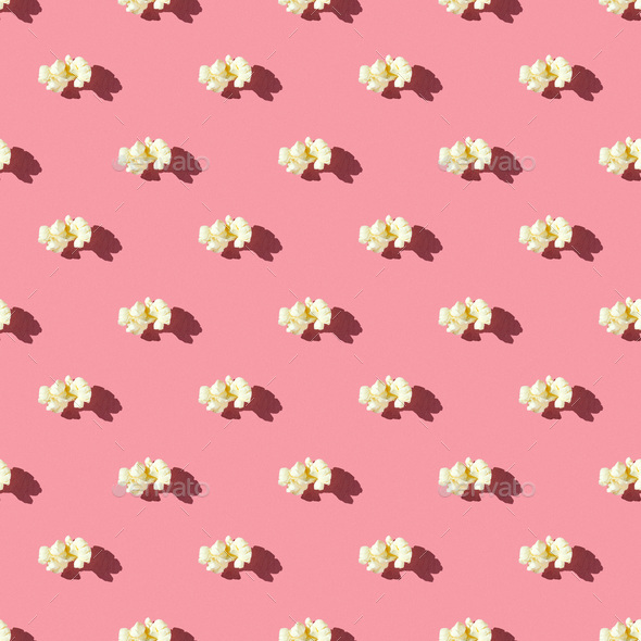 seamless pattern of single popcorn on a pink background with hard light ...