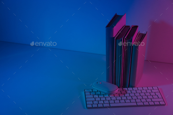 Concept of books vs technology, space for text Stock Photo by AtlasComposer