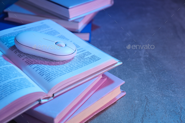 Concept of books vs technology, space for text Stock Photo by AtlasComposer