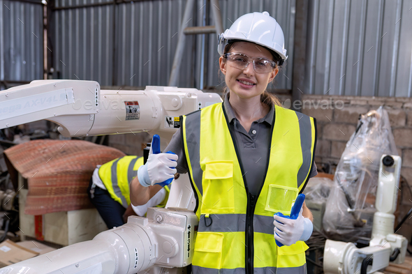 Maintenance shop engineer commissioning and operate robot arm after ...