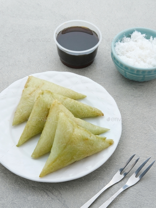 Lupis or Lopis, a traditional Indonesian food Stock Photo by tyasindayanti