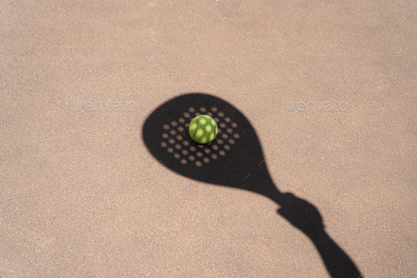 Shadow of padel racket over ball Stock Photo by diignat | PhotoDune