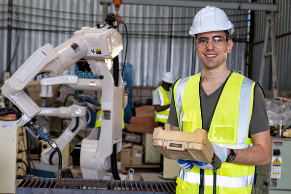 Maintenance shop engineer commissioning and operate robot arm after ...