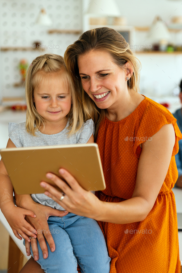 Device technology family online education concept. Happy family with ...