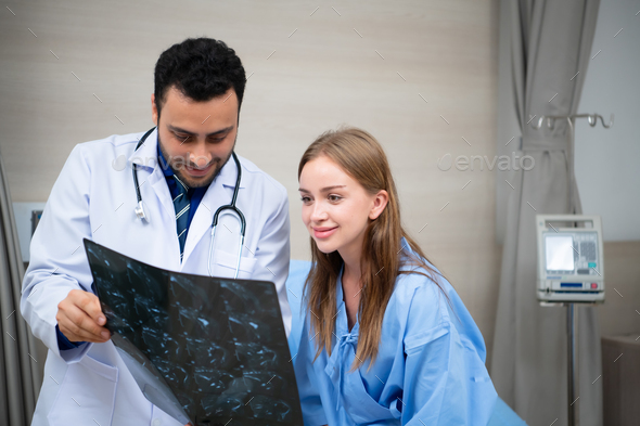 Doctor see brain x-ray results of a patient who suffered a concussion ...