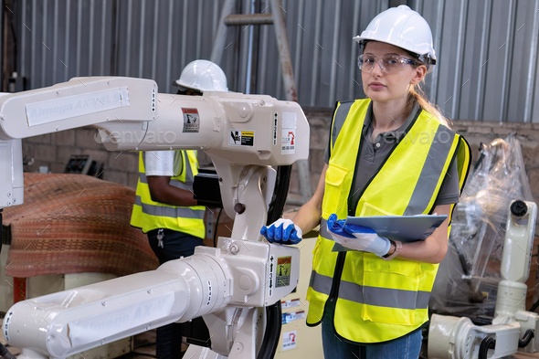 Maintenance shop engineer commissioning and operate robot arm after ...