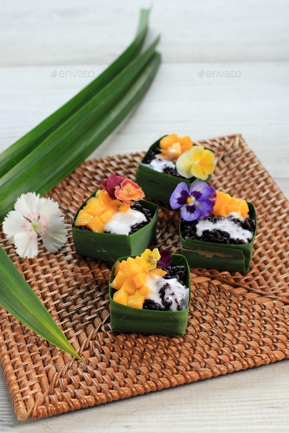 Homemade Coconut Black Sticky Rice with Mango in Pandan Leaves Cup ...