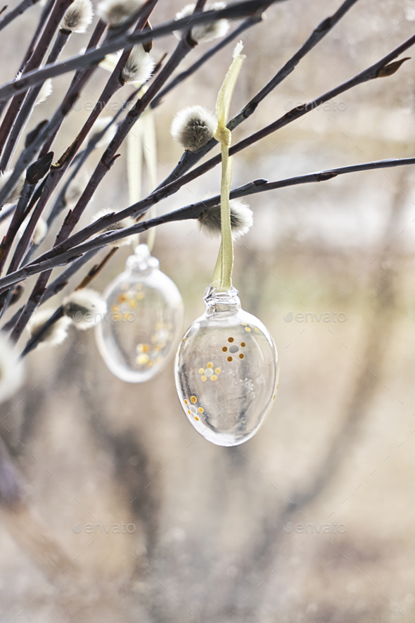Bunch of willow sprigs decorated for Easter with decorative glass ...