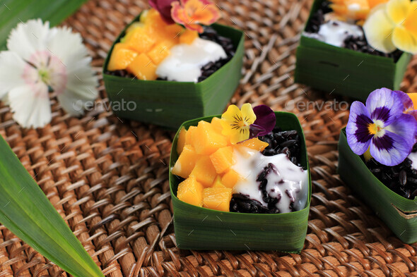Homemade Coconut Black Sticky Rice with Mango in Pandan Leaves Cup ...