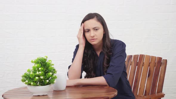 Stressed Indian girl at a cafe, Stock Footage | VideoHive