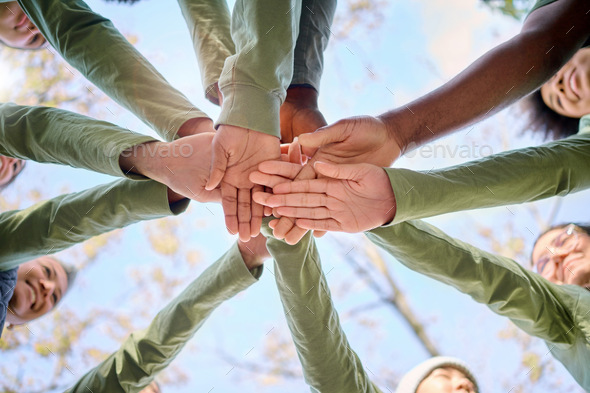 Teamwork, collaboration and low angle of people with hands together for team building ...
