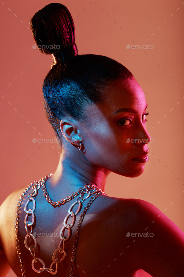Glamour, jewelry and portrait of a model in a studio with neon lights ...