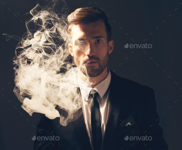 Executive, portrait and man with smoke in a suit for fashion isolated ...