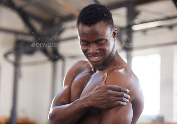 Black man, exercise and arm pain or sports injury at gym for ...