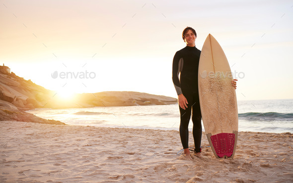 Surfer, portrait and man with surfboard at the sea, beach and ocean in ...