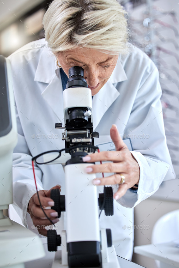 ophthalmology, microscope and glasses with a woman doctor with tools to ...