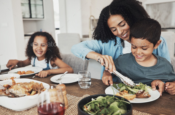 Mom, children and eating food in home together for lunch, dinner table ...