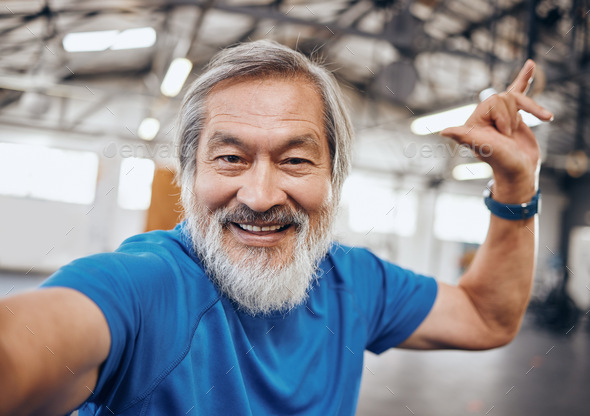 Fitness, selfie and portrait of Asian man in gym with hand sign for motivation, wellness and ...