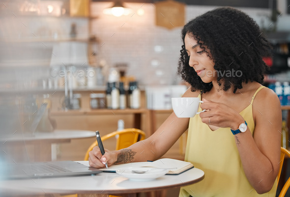 Cafe, freelancer and woman writing notes for a freelance project while ...