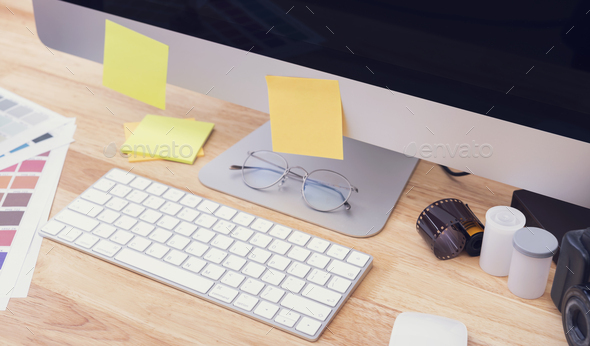 Top View of creative table with large desktop computer. working Place ...
