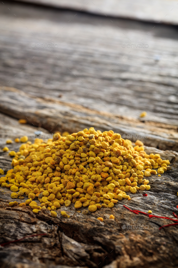 Bee pollen pile set on old wooden surface Stock Photo by rawf8 | PhotoDune