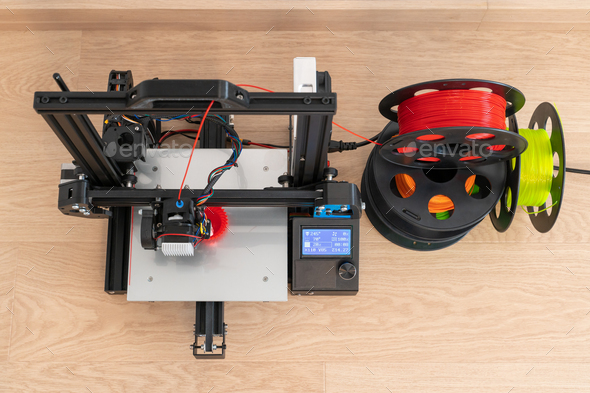Modern 3D printer and multi-colored filament spools Stock Photo by ...