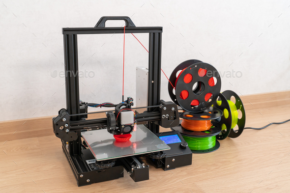 Modern 3D printer and multi-colored filament spools Stock Photo by ...