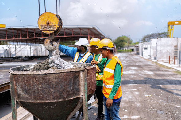At building construction site supervisor check concrete mold and bucket ...