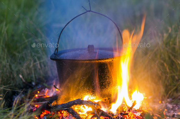 Camping kitchenware - pot on the fire at an outdoor campsite Stock ...