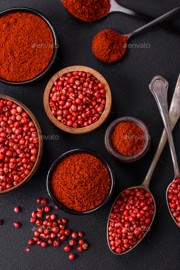 Spice smoked paprika in the form of powder in bowls and spoons Stock ...