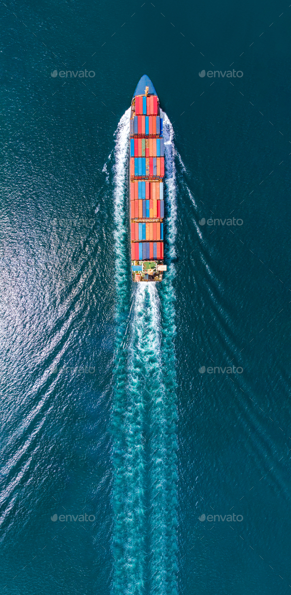 Aerial portrait view of smart cargo ship with contrail in the ocean sea ...