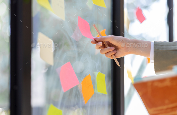 Business female employee with many conflicting priorities arranging ...