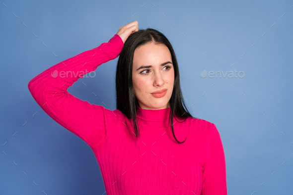 woman in studio showing hesitation gesture Stock Photo by ...