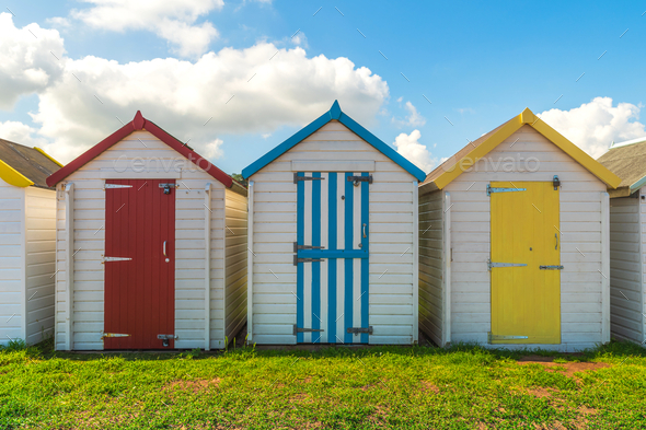 Colorful small beach houses. Multicolored beach sheds. Variety of ...