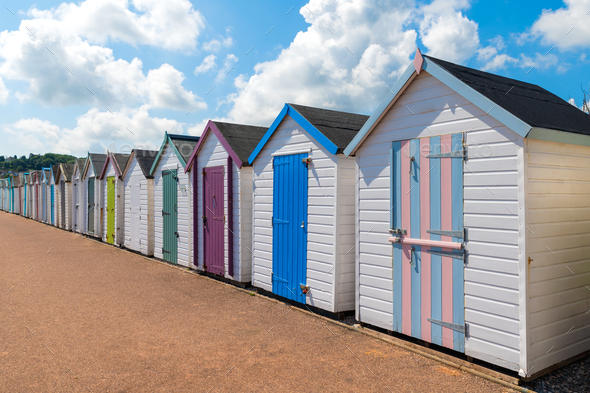 Colorful small beach houses. Multicolored beach sheds. Variety of ...