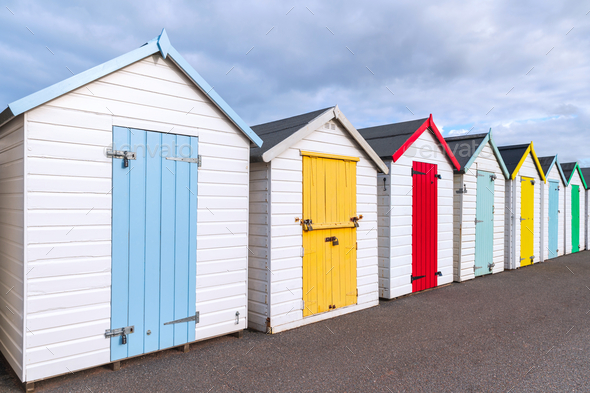 Colorful small beach houses. Multicolored beach sheds. Variety of ...