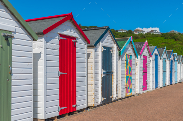 Colorful small beach houses. Multicolored beach sheds. Variety of ...