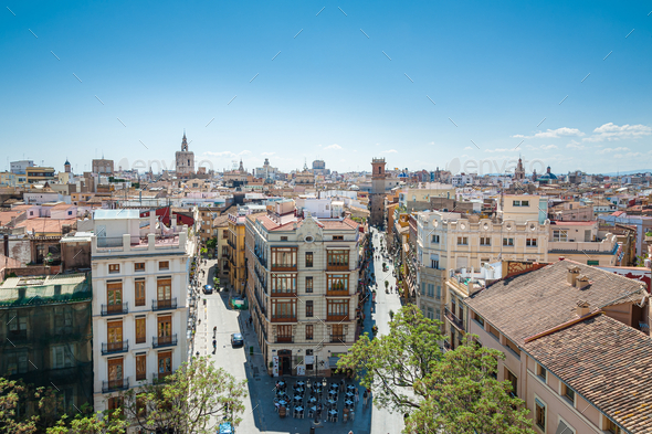 View at Valencia downtown with people walking in the street. Rooftops ...