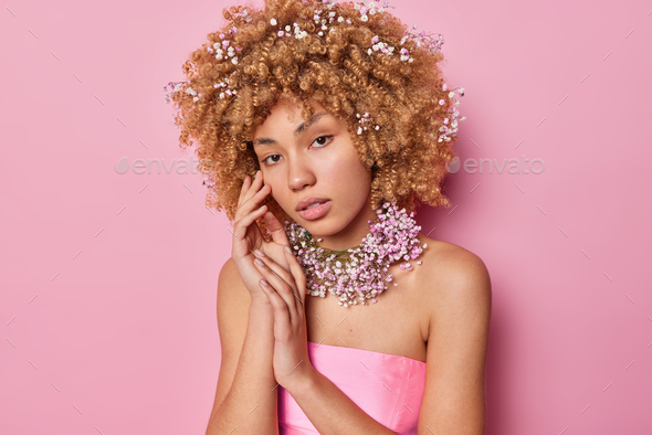 Beautiful Curly Haired European Woman Keeps Hands Near Face Has Gentle